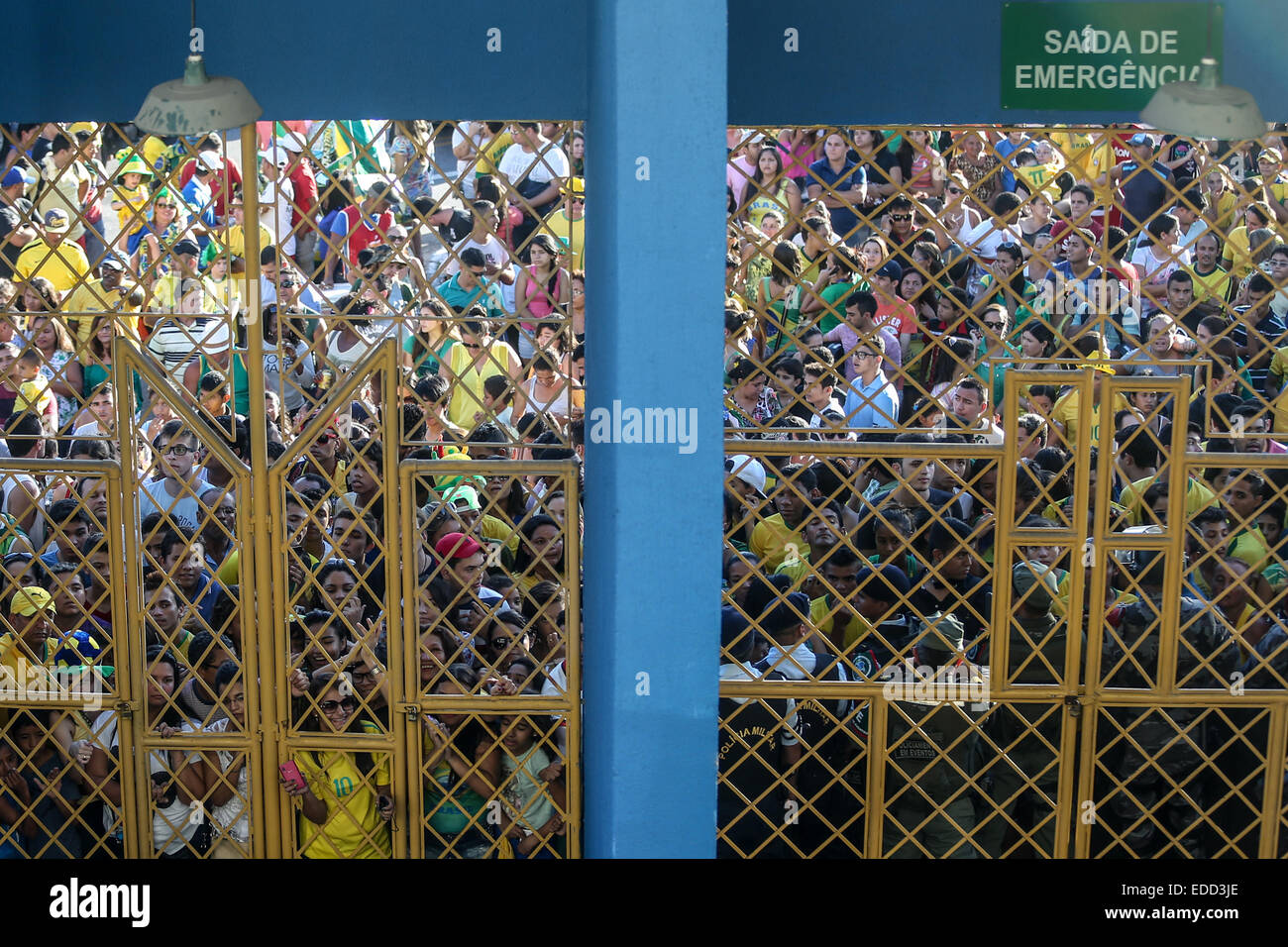 2014 FIFA World Cup - Brazilian football fans crowd outside the gate as ...
