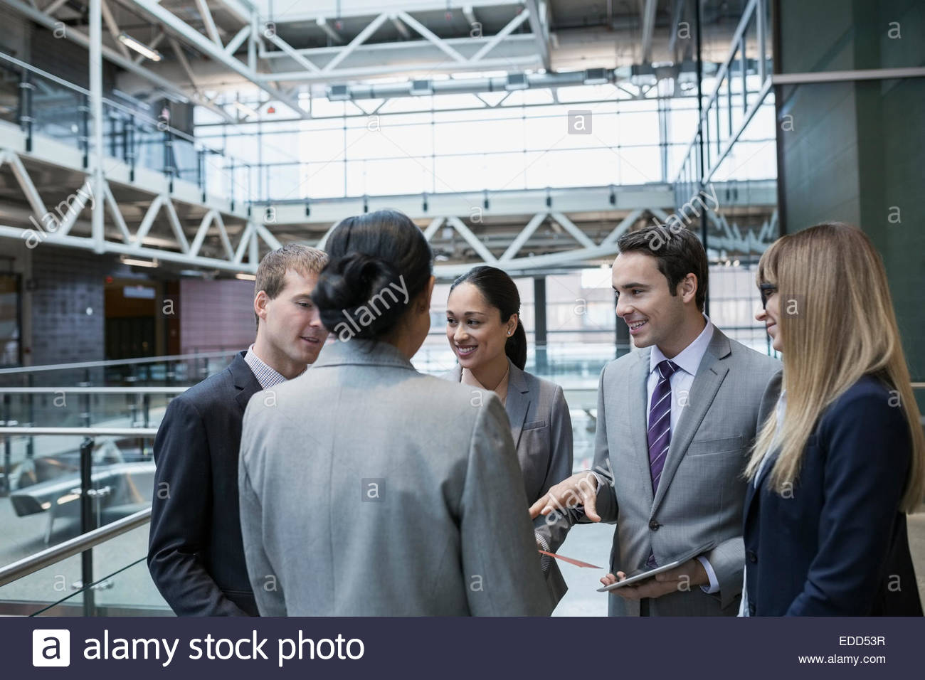 Business people meeting in atrium Stock Photo - Alamy