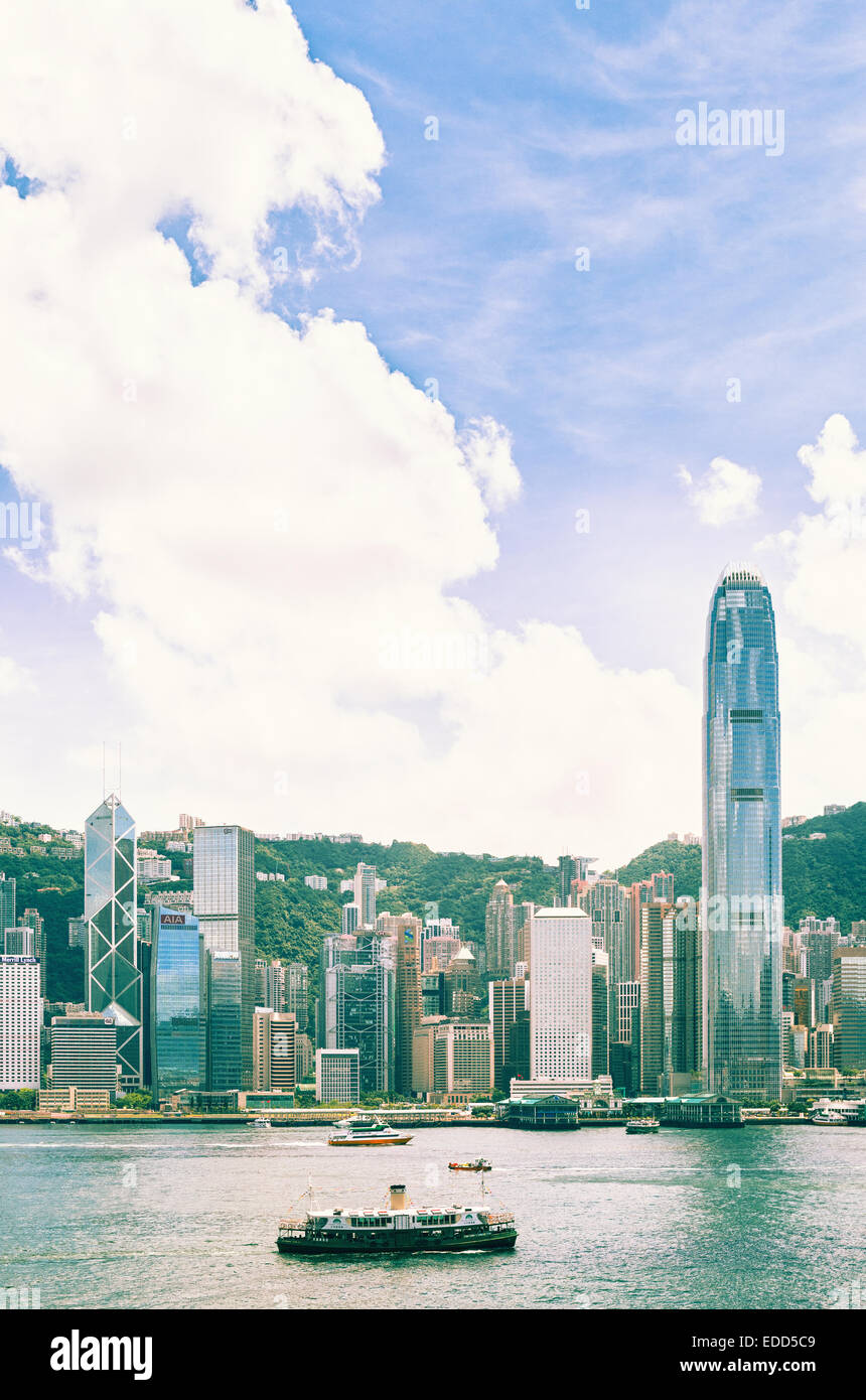 skyline of Hong Kong Victoria Harbour with ferry cruising Stock Photo ...