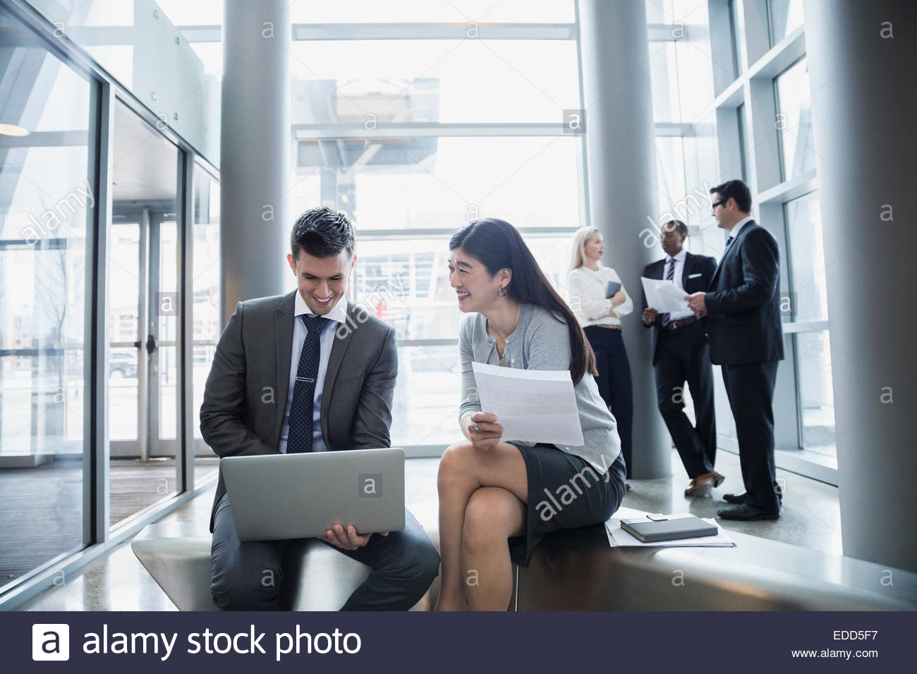 Businessman and businesswoman using laptop Stock Photo - Alamy Businessman and businesswoman using laptop Stock Photo - Alamy