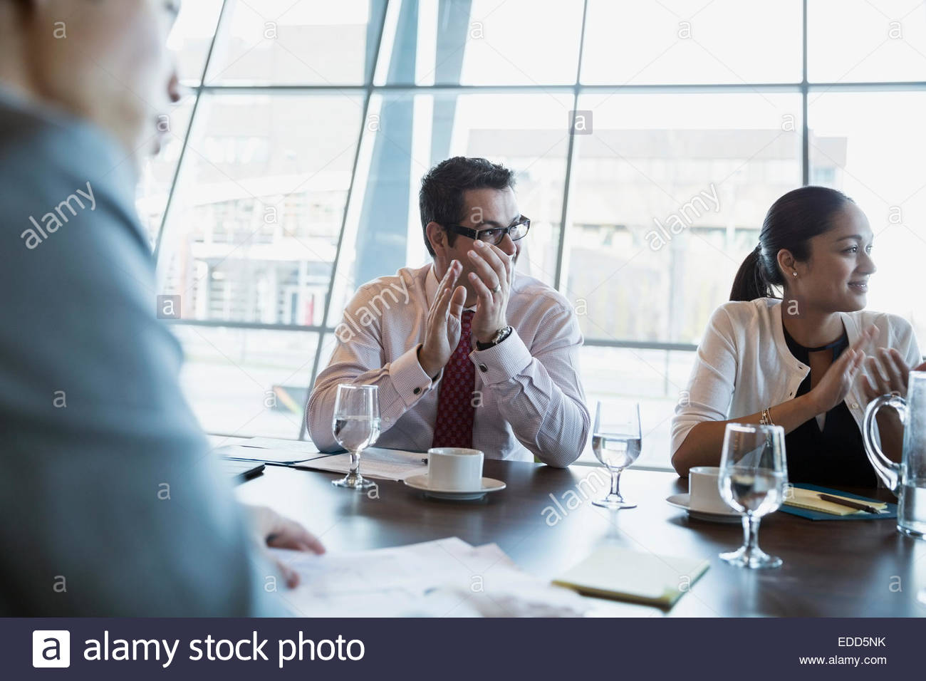 Businesswoman clapping in meeting hi-res stock photography and images ...