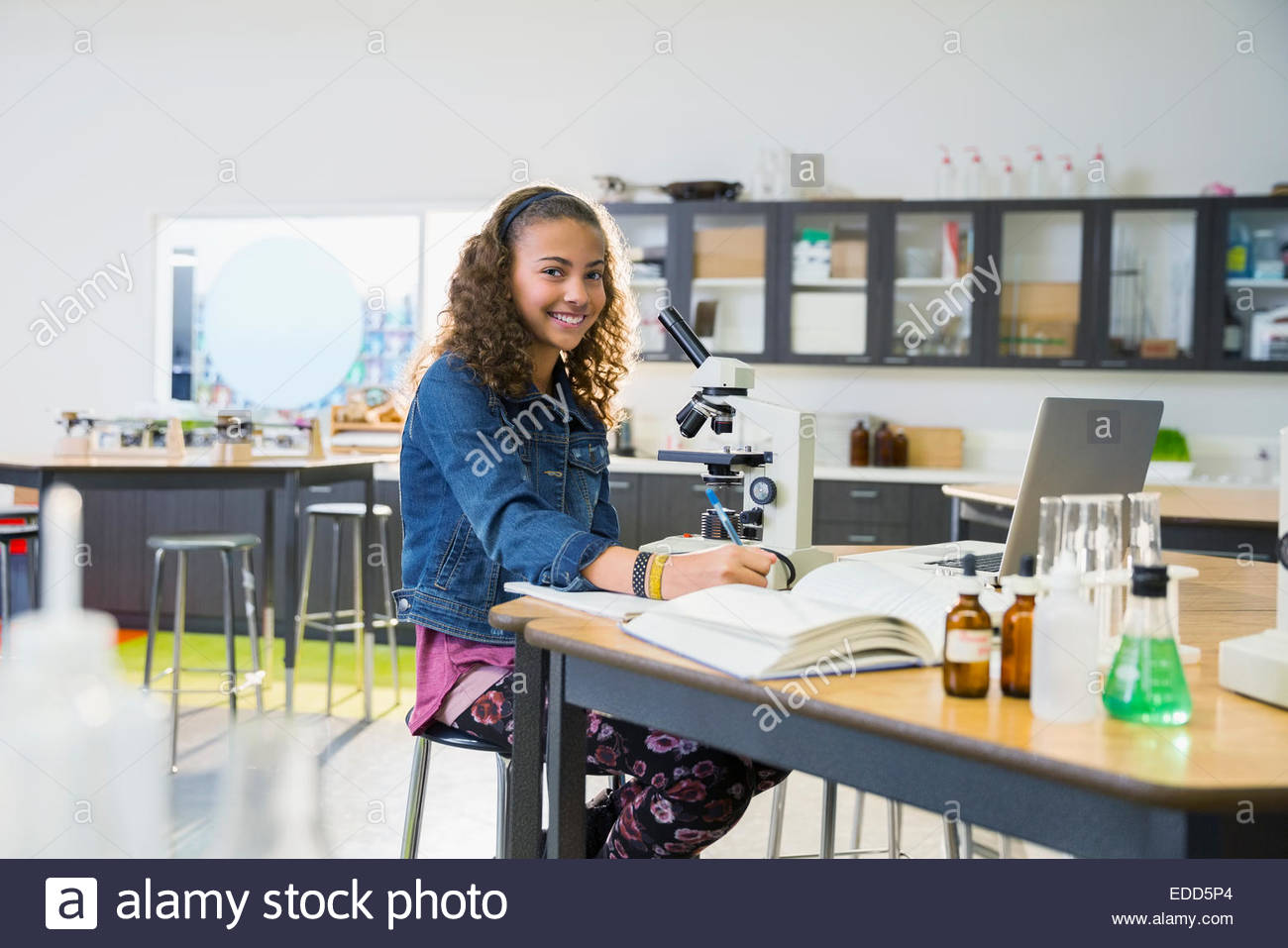 Portrait of smiling elementary student in laboratory Stock Photo - Alamy