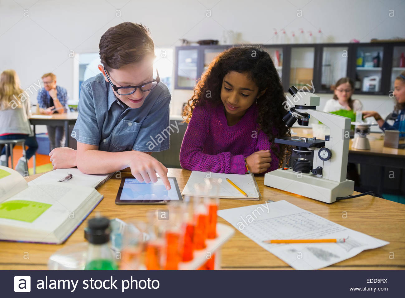 Black students using microscope in lab hi-res stock photography and ...