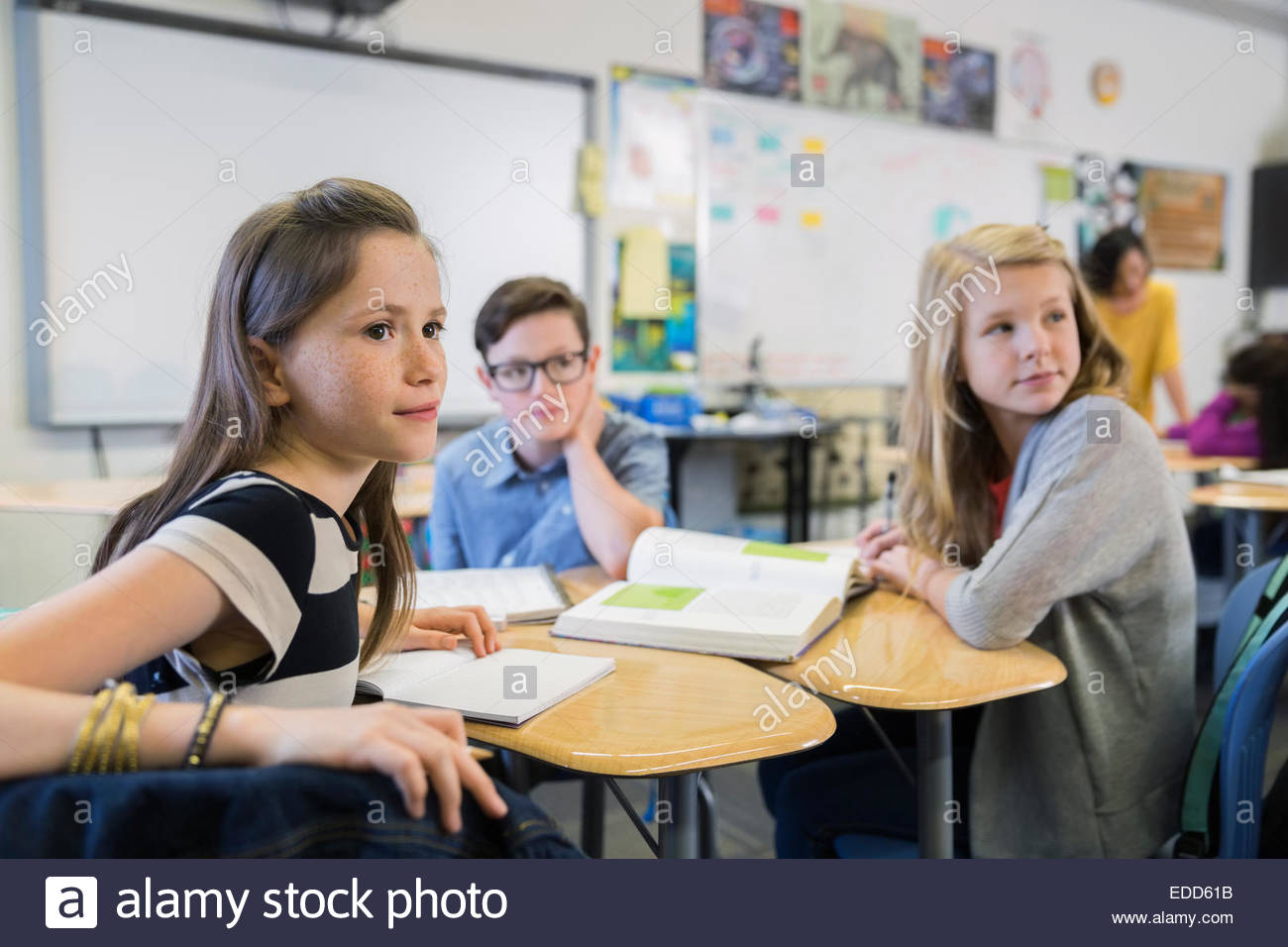 Elementary students at desks in classroom Stock Photo - Alamy