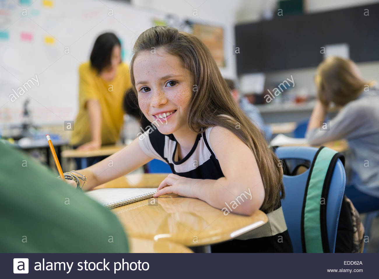 Portrait of confident elementary student in classroom Stock Photo - Alamy