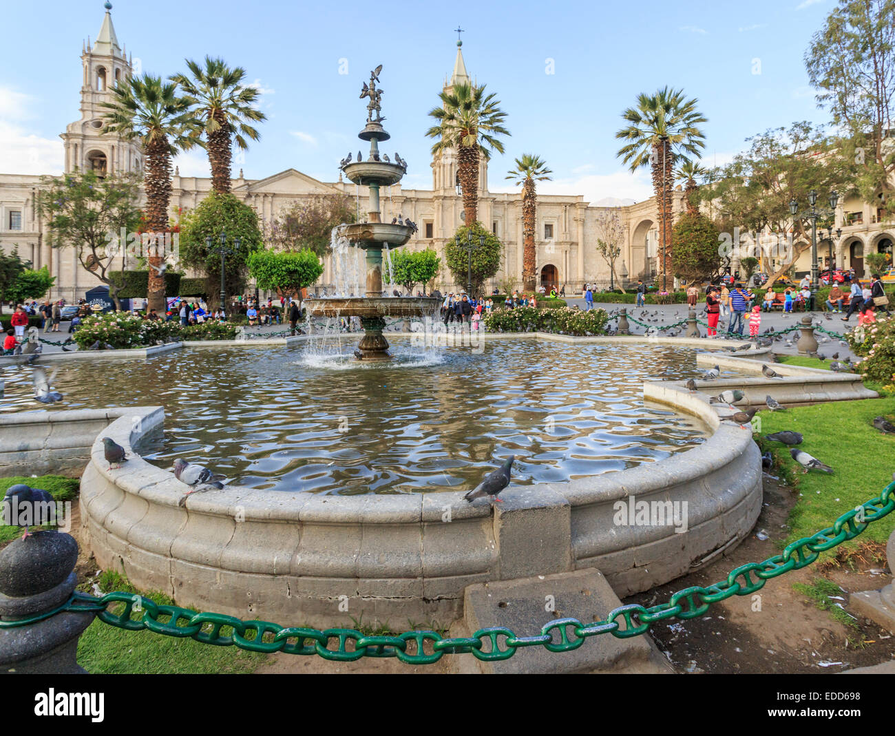View of a fountain in the famous Plaza de Armas, town square in ...