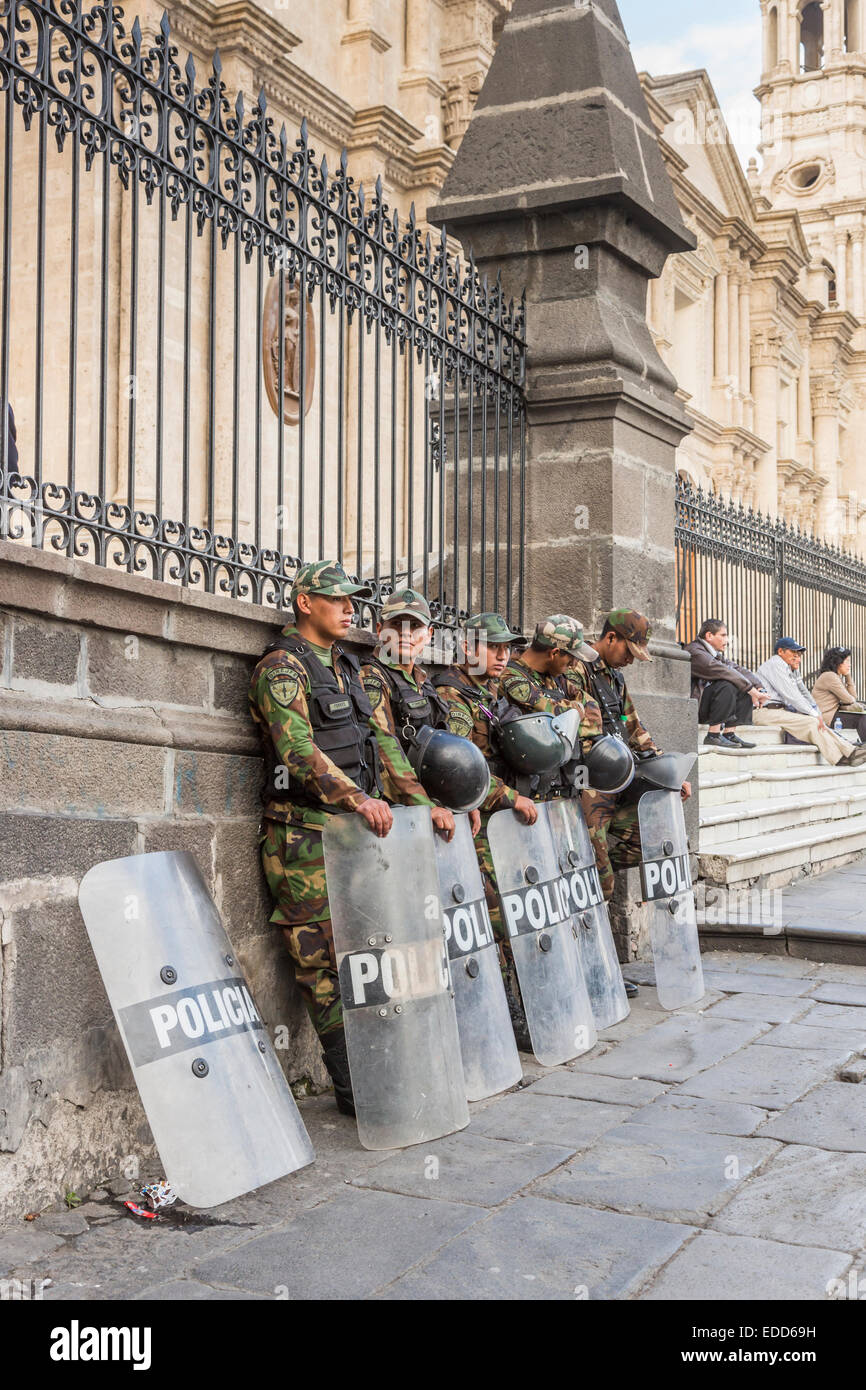 Peruvian riot police wearing camouflage uniform with shields and ...
