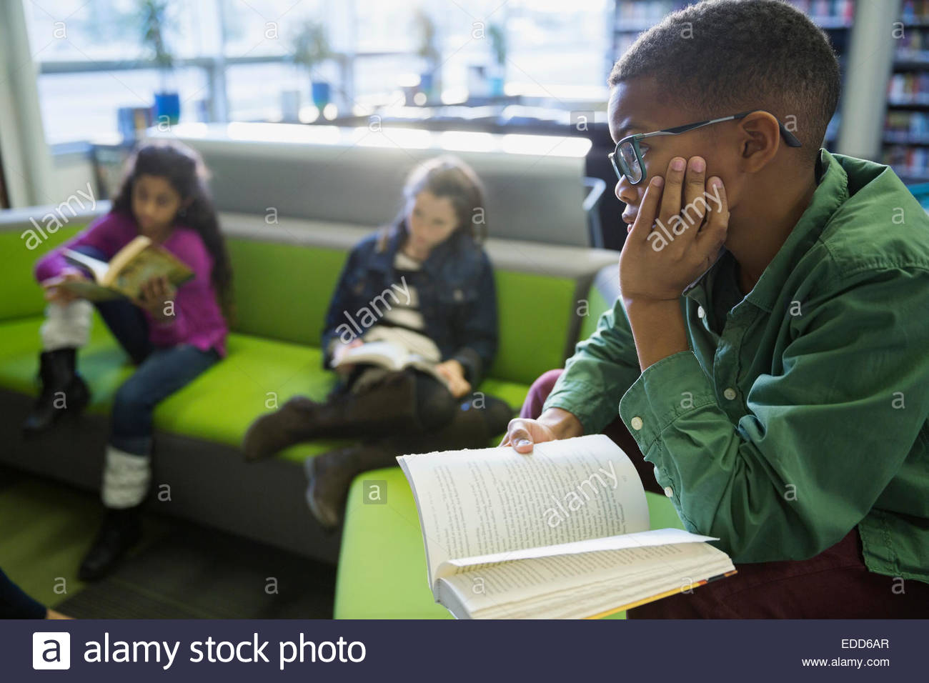 American indian boy reading hi-res stock photography and images - Alamy