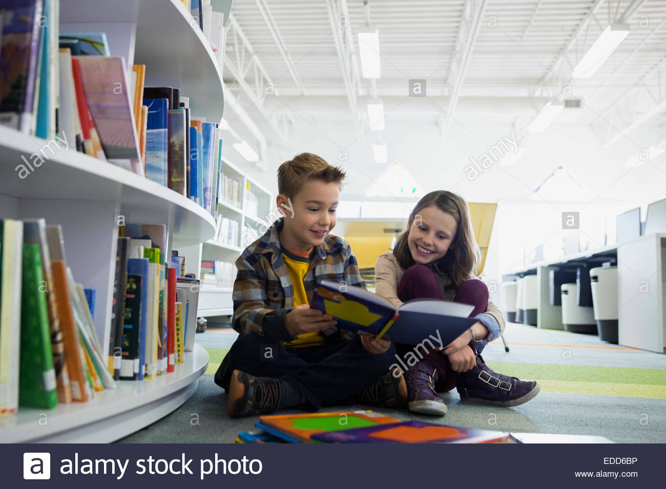 Cross legged girl books hi-res stock photography and images - Alamy