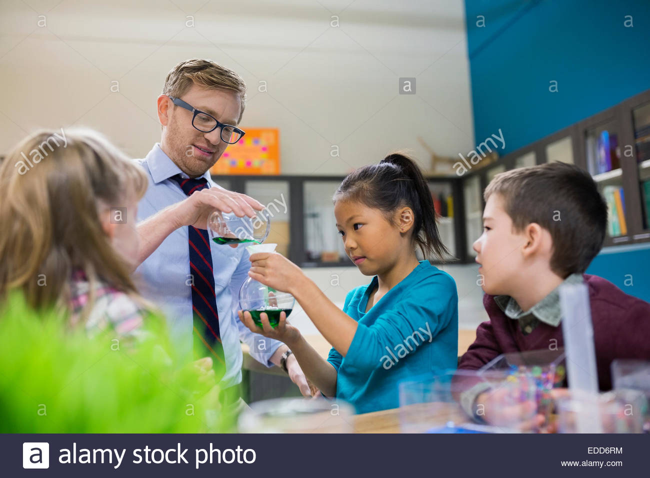 Elementary school students helping hi-res stock photography and images ...