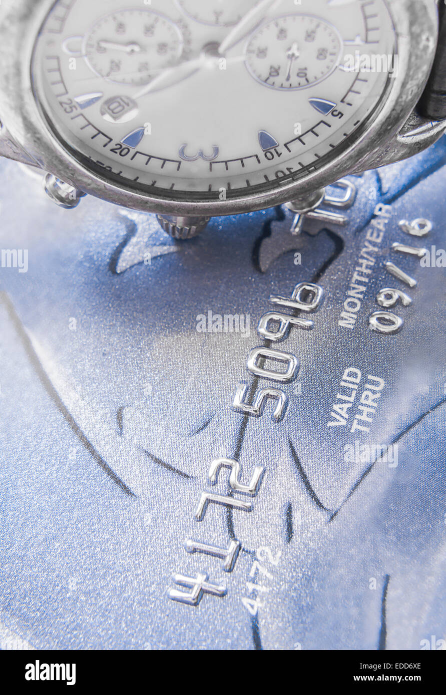 Credit cards and a watch up close Stock Photo - Alamy