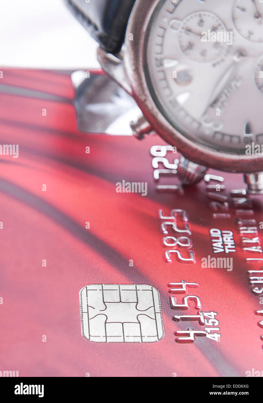 Credit cards and a watch up close Stock Photo - Alamy