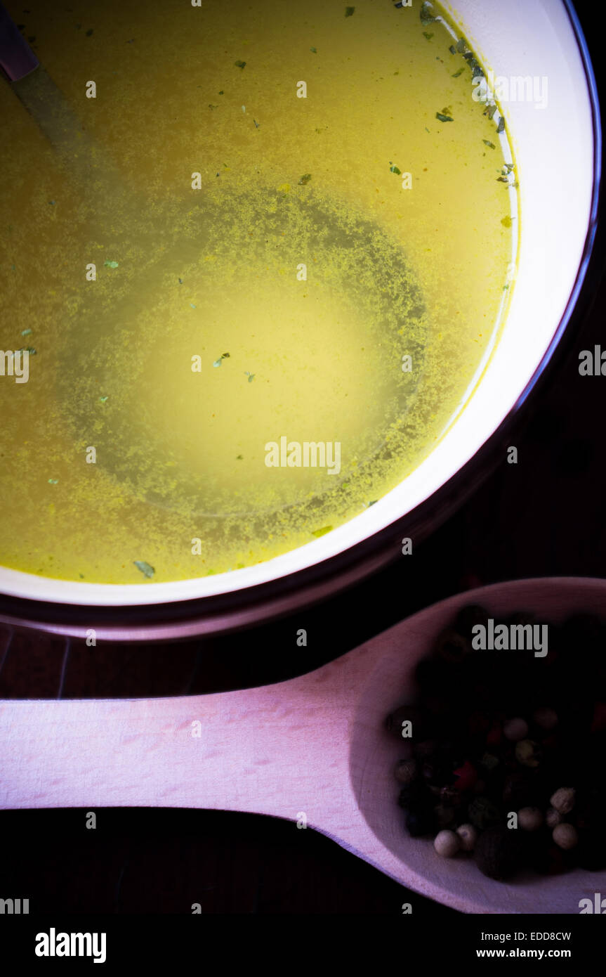 Broth, bouillon, clear soup with soup ladle Stock Photo - Alamy
