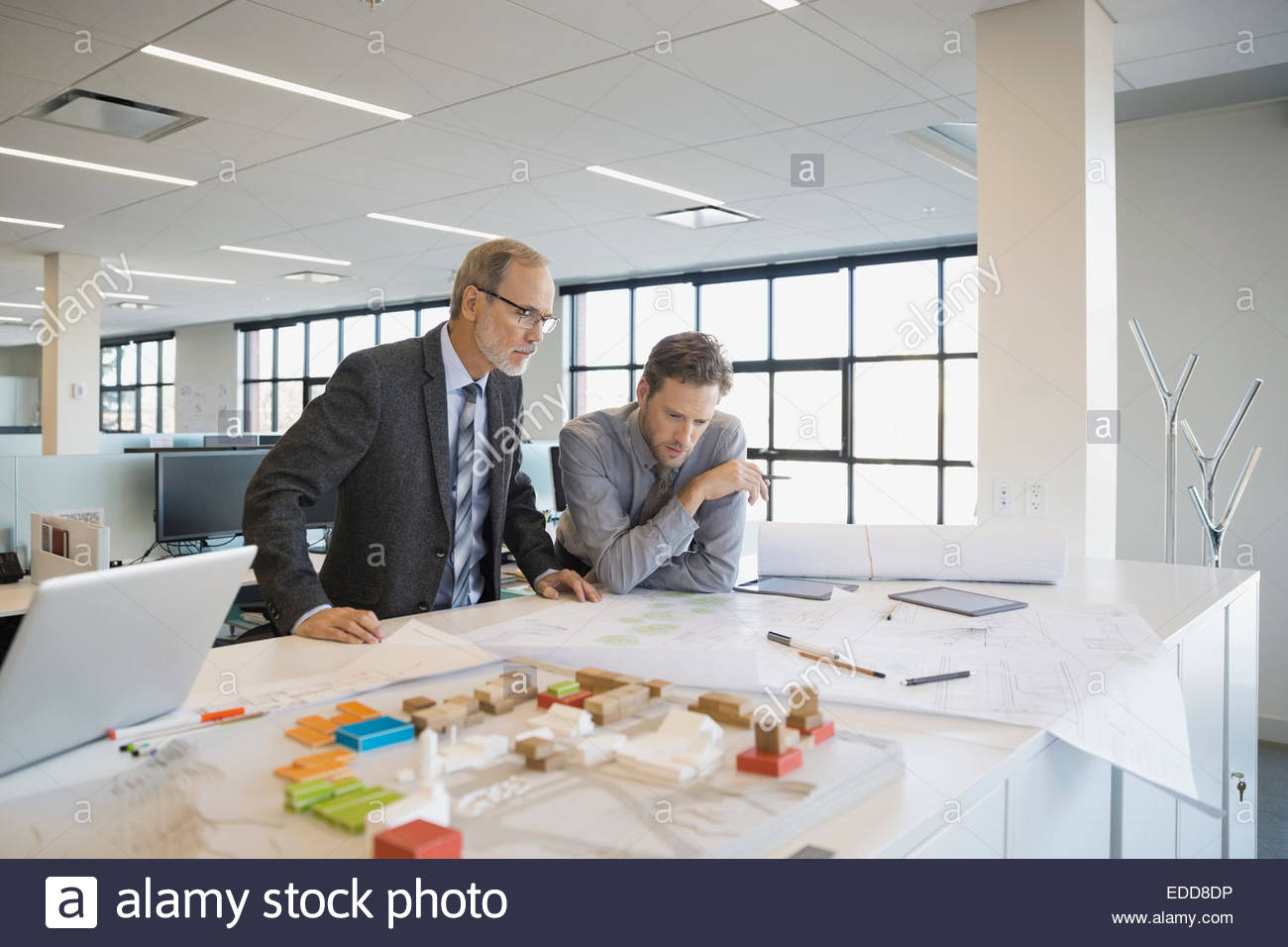 Business people looking blueprints model hi-res stock photography and ...