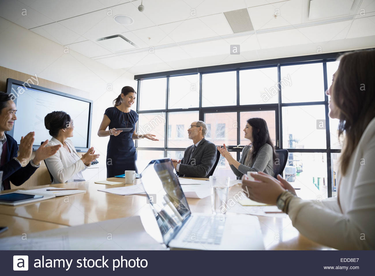 A group of happy business people clapping in a meeting Stock Photo - Alamy
