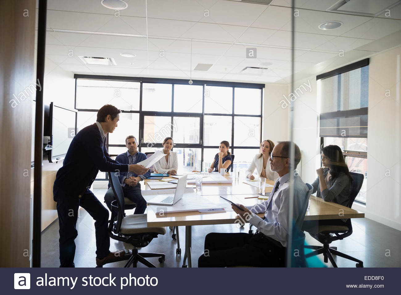 Businessman leading meeting in conference room Stock Photo - Alamy