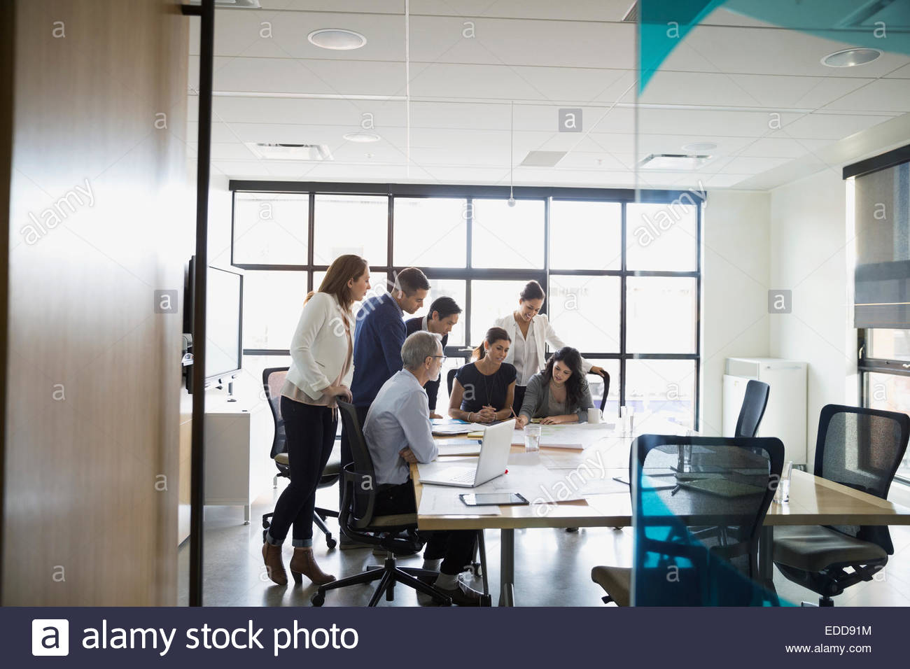 Group people huddled together hi-res stock photography and images - Alamy