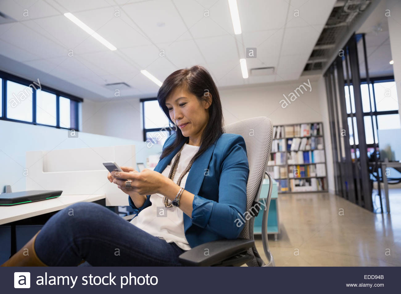 Asian women desk texting hi-res stock photography and images - Alamy