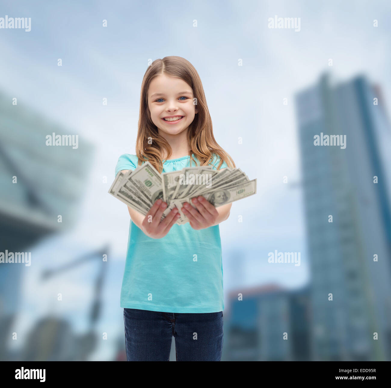 smiling little girl giving dollar cash money Stock Photo - Alamy
