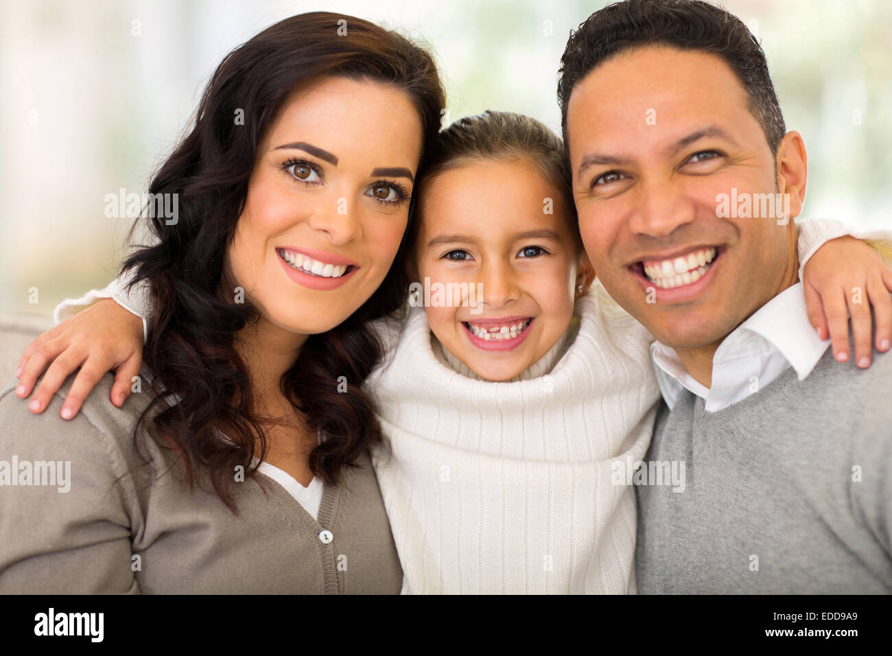 Parents hugging daughter hi-res stock photography and images - Alamy
