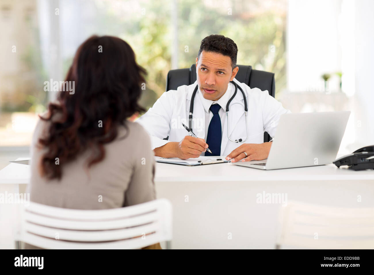 professional medical doctor consulting patient in office Stock Photo ...