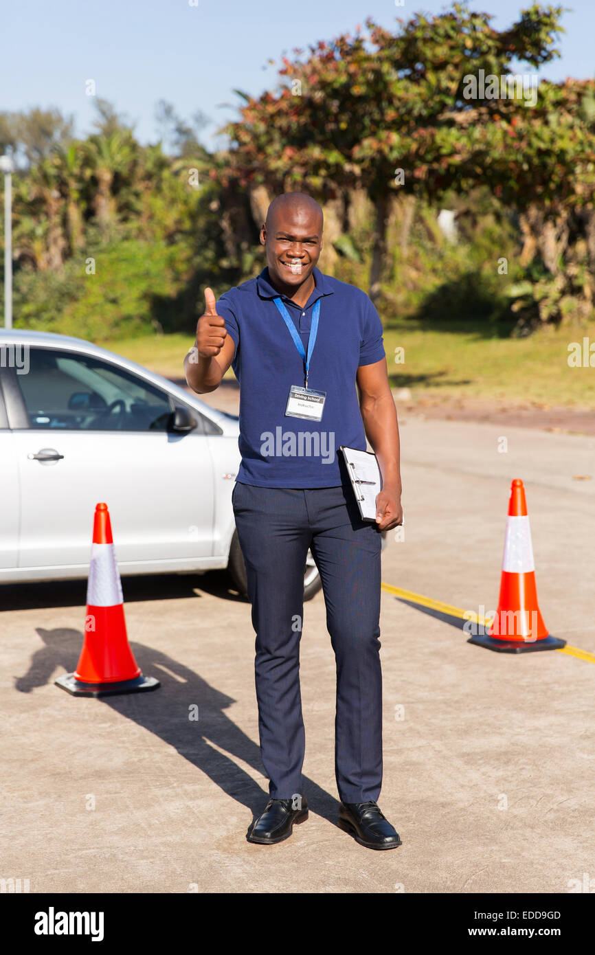 happy driving instructor in testing ground giving thumb up Stock Photo ...