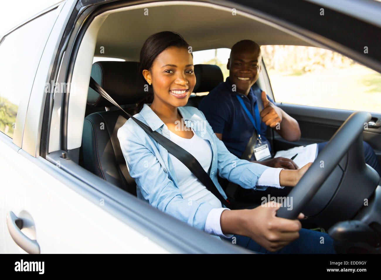 Young black woman driving hi-res stock photography and images - Alamy