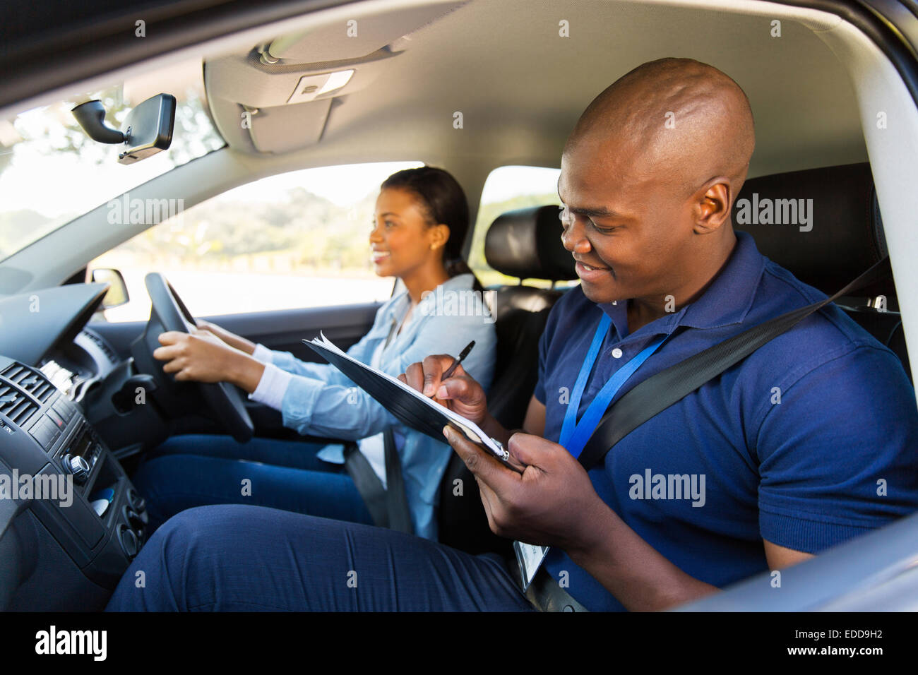 African girl sitting writing hi-res stock photography and images - Alamy