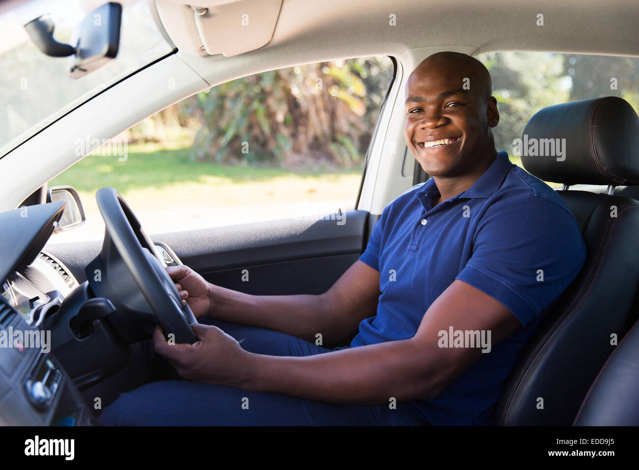 cheerful African man inside his new car Stock Photo - Alamy