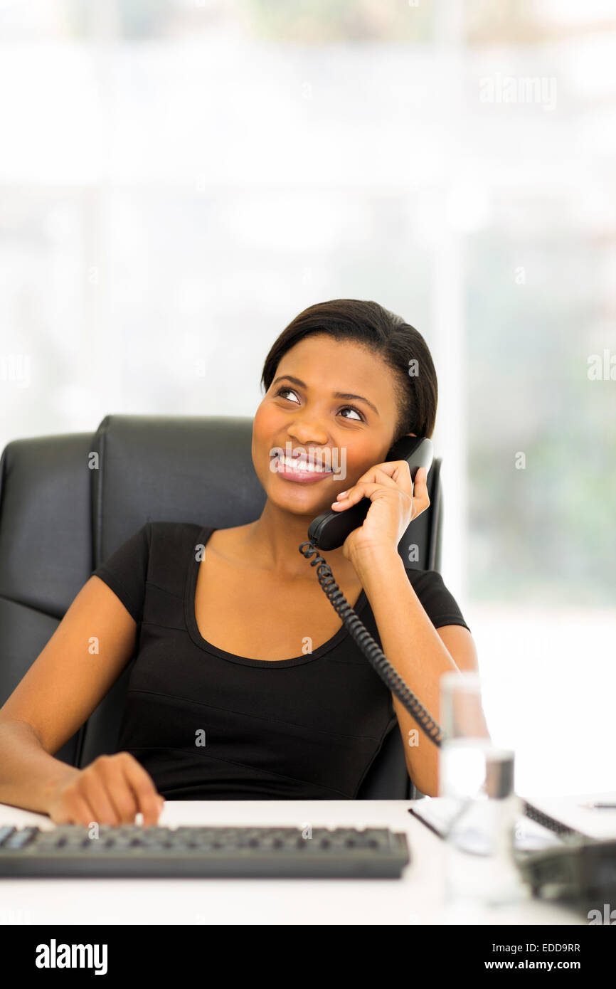 beautiful young African businesswoman using landline phone Stock Photo ... beautiful young African businesswoman using landline phone Stock Photo ...