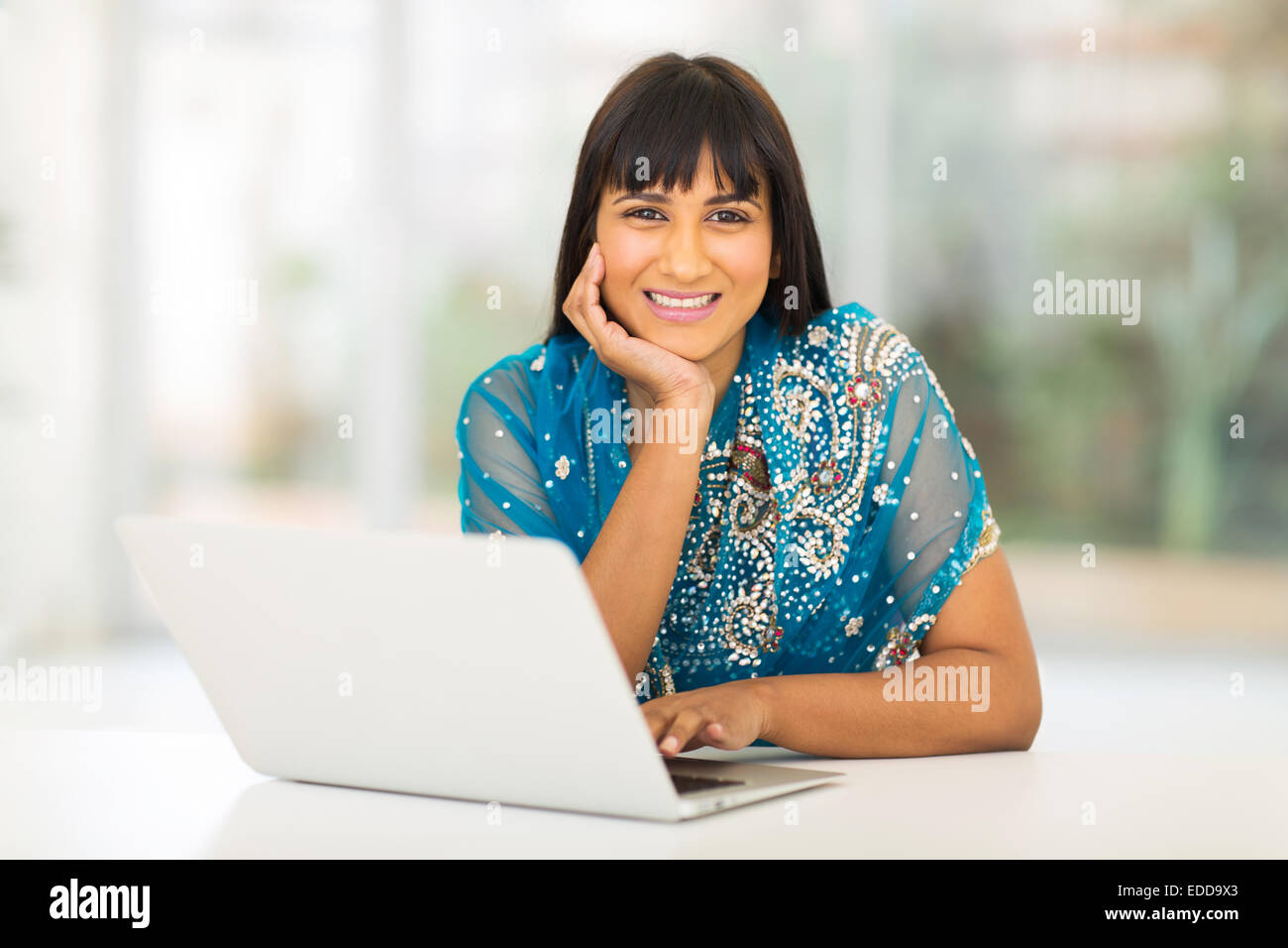 pretty Indian woman using laptop at home Stock Photo - Alamy