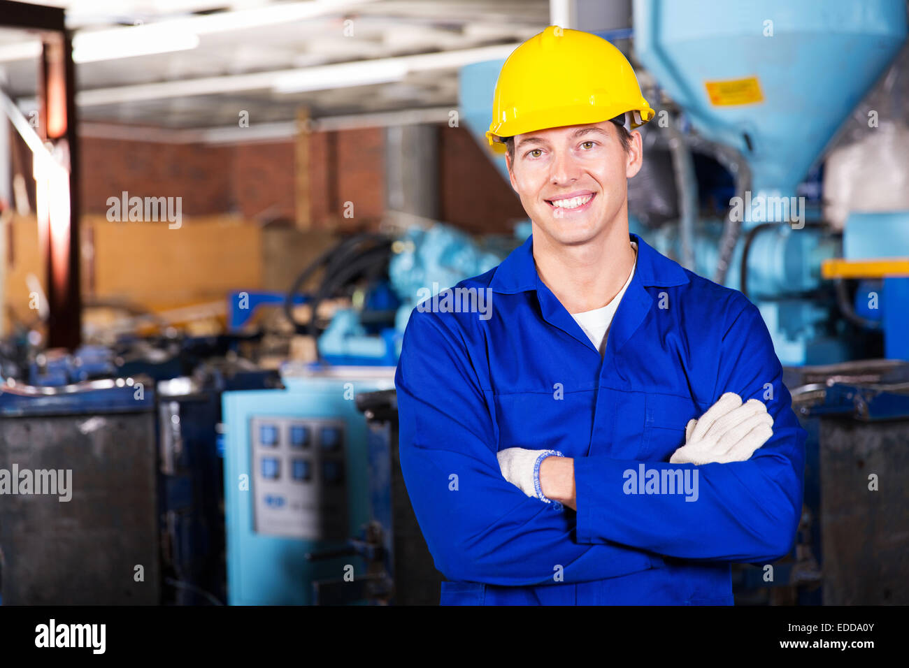 Worker in blue uniform helmet hi-res stock photography and images - Alamy
