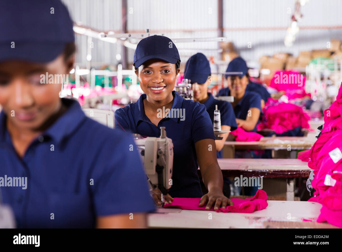 happy African textile workers on the production line Stock Photo - Alamy