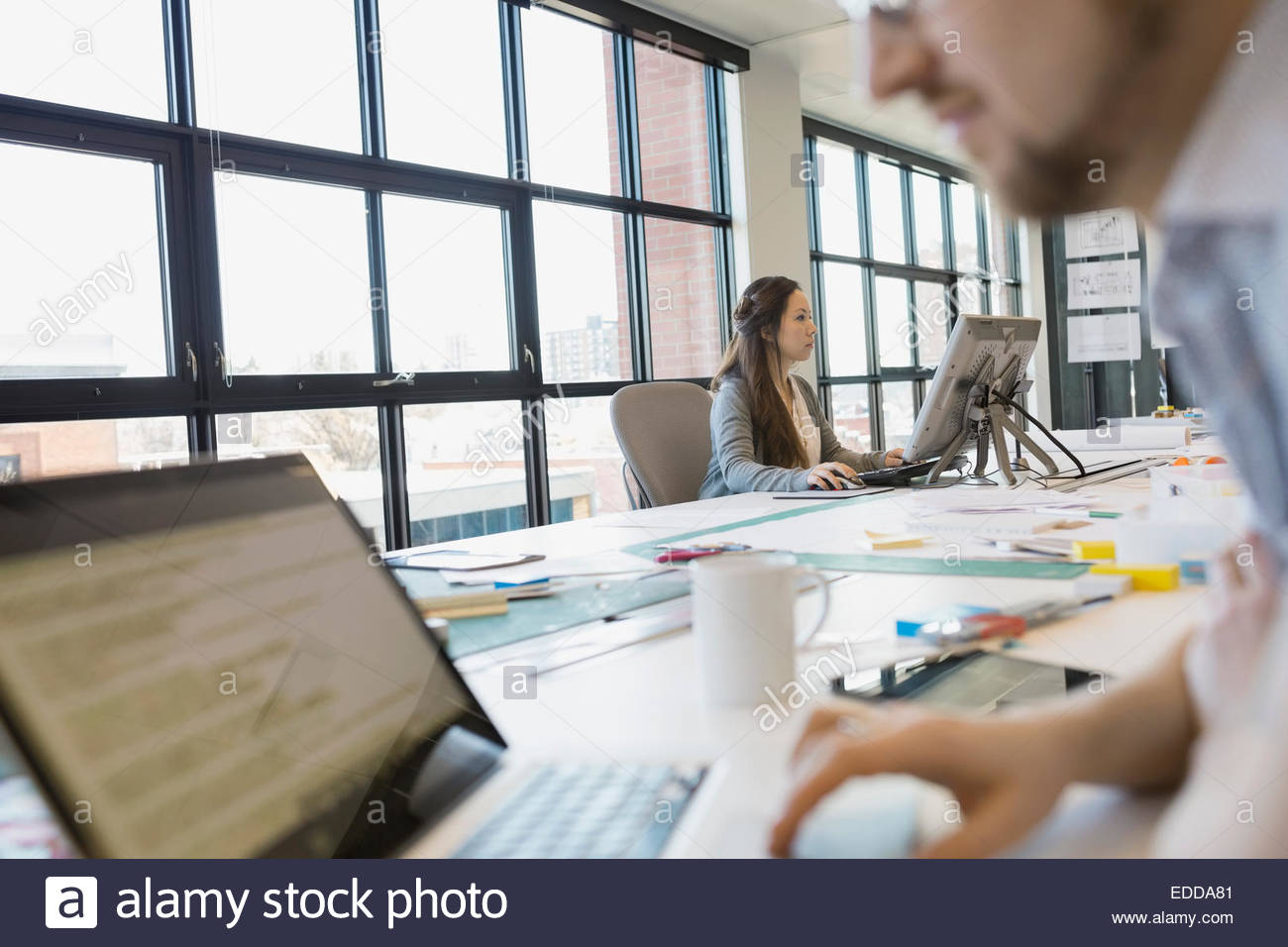 People sitting computers working office hi-res stock photography and ...