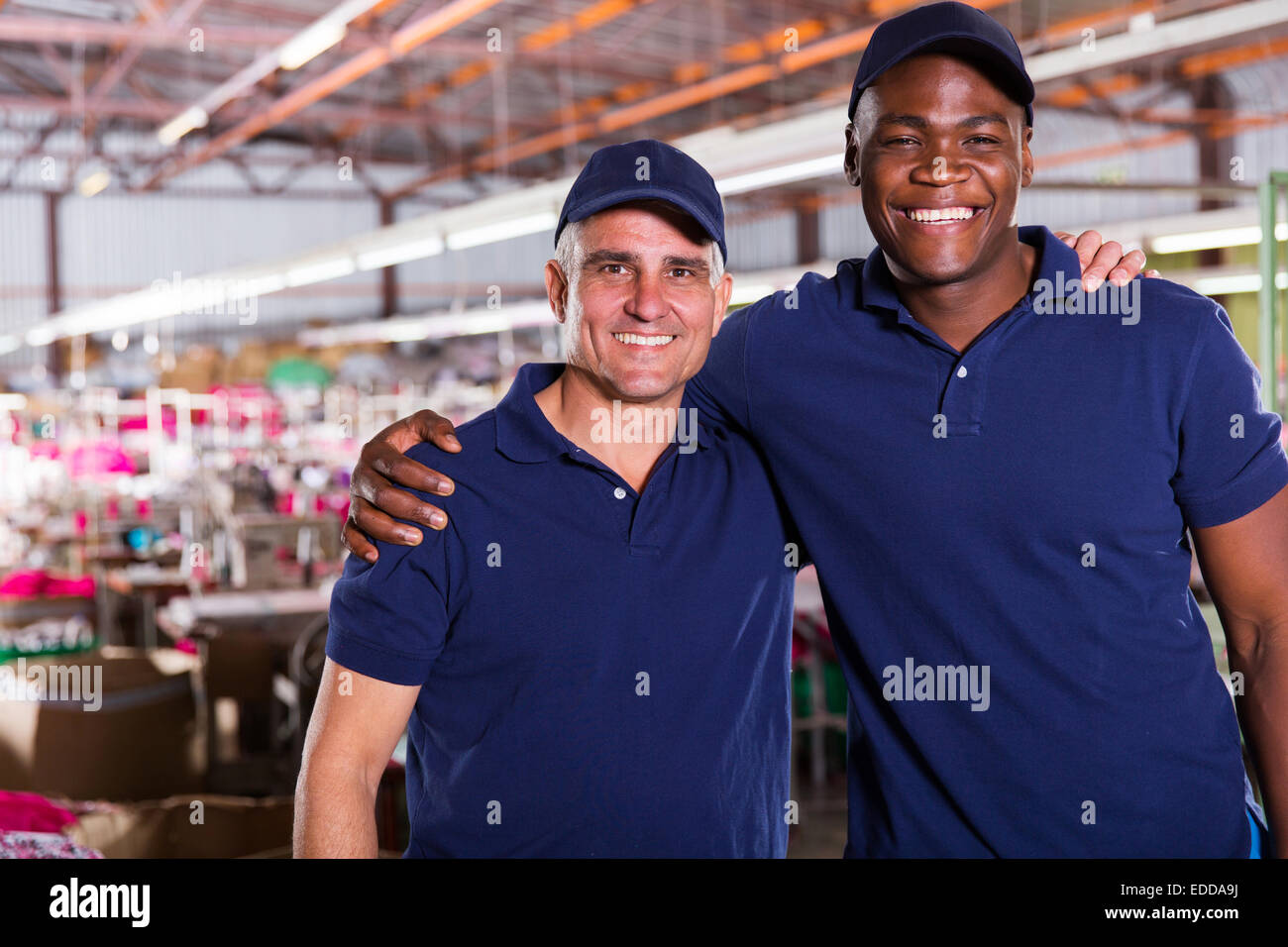 textile co-workers looking at the camera in factory Stock Photo - Alamy