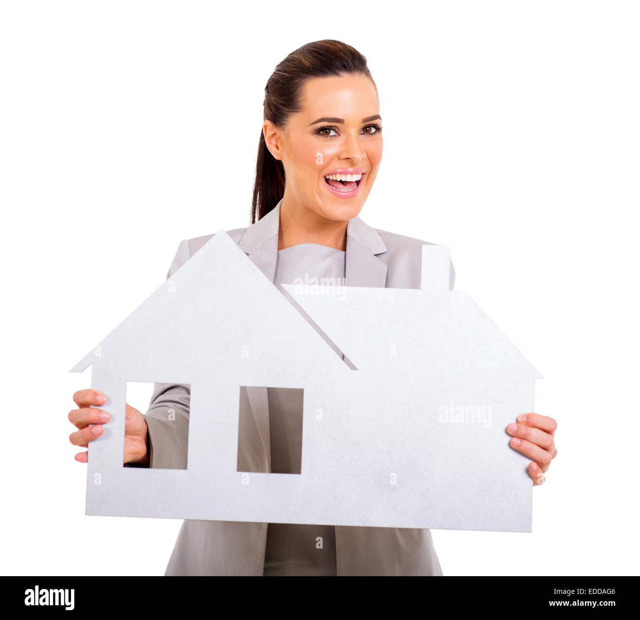 beautiful young woman woman presenting paper house on white background ...