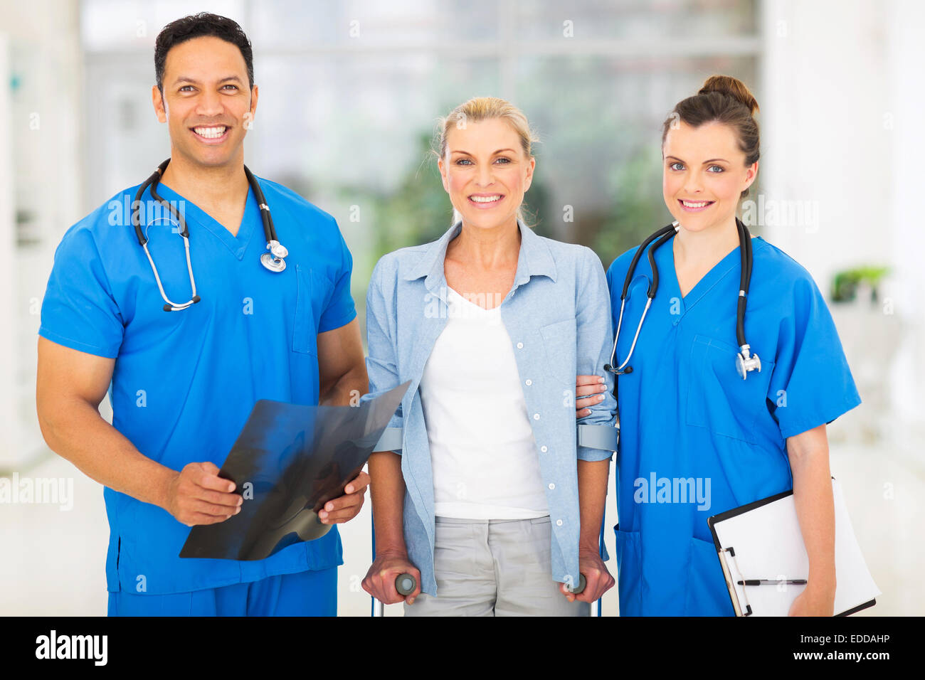 portrait of happy medical doctors with middle aged patient Stock Photo ...