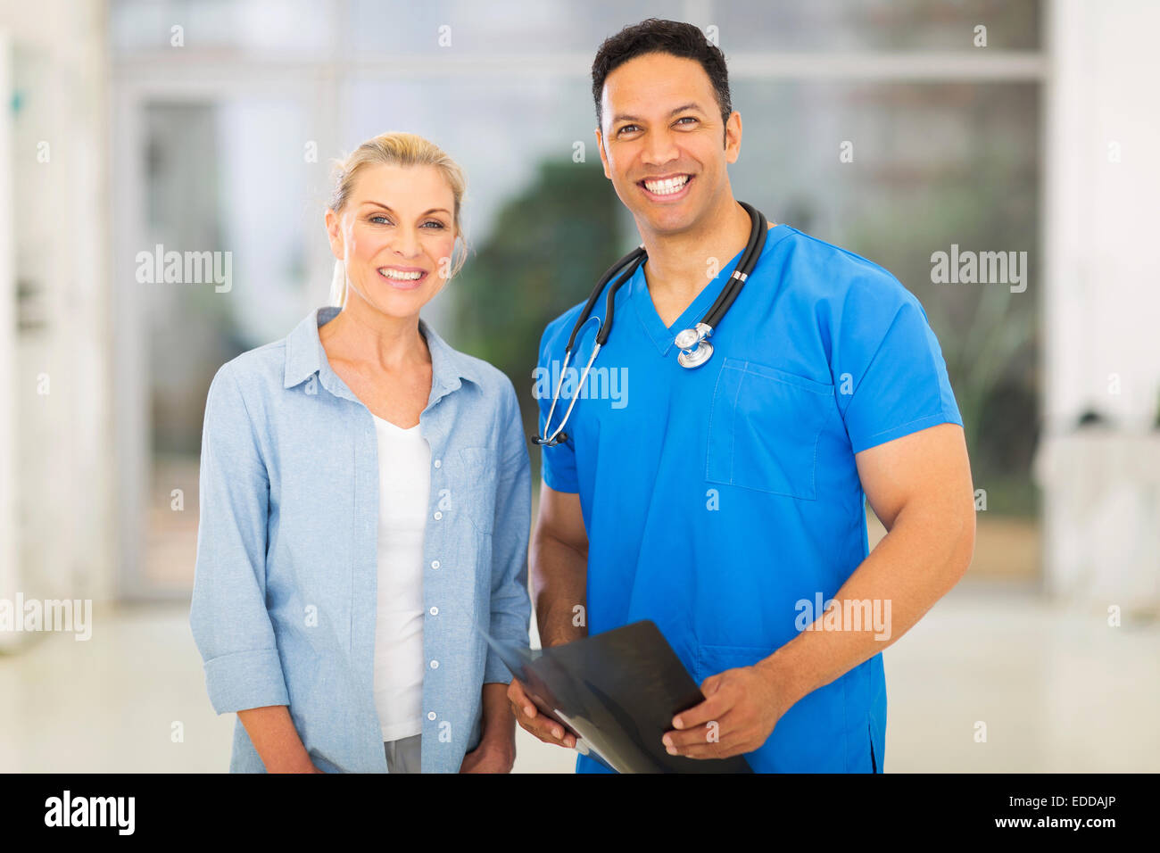 portrait of friendly medical doctor standing with senior patient Stock ...