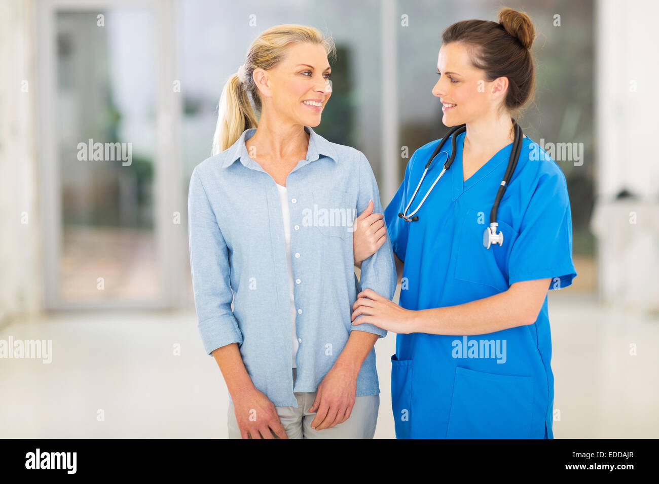 caring female medical doctor talking to senior patient Stock Photo - Alamy