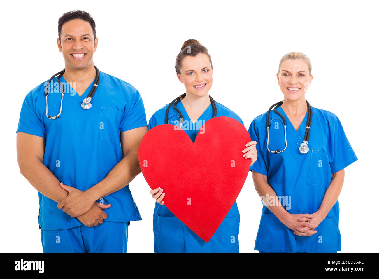 beautiful young nurse holding heart shape with colleagues Stock Photo ...