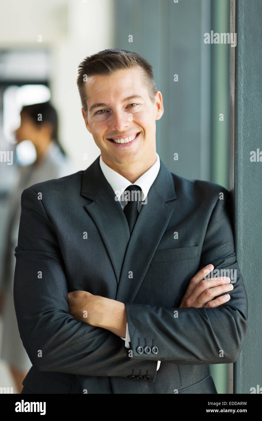Handsome businessman folded arms hi-res stock photography and images ...