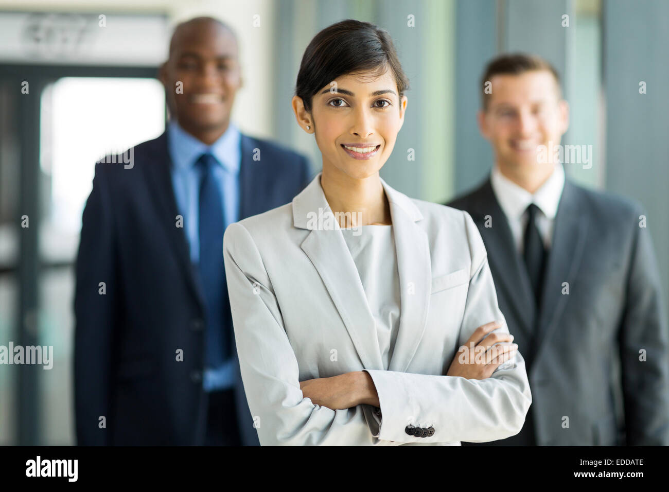 beautiful female business leader with team standing on background Stock ...