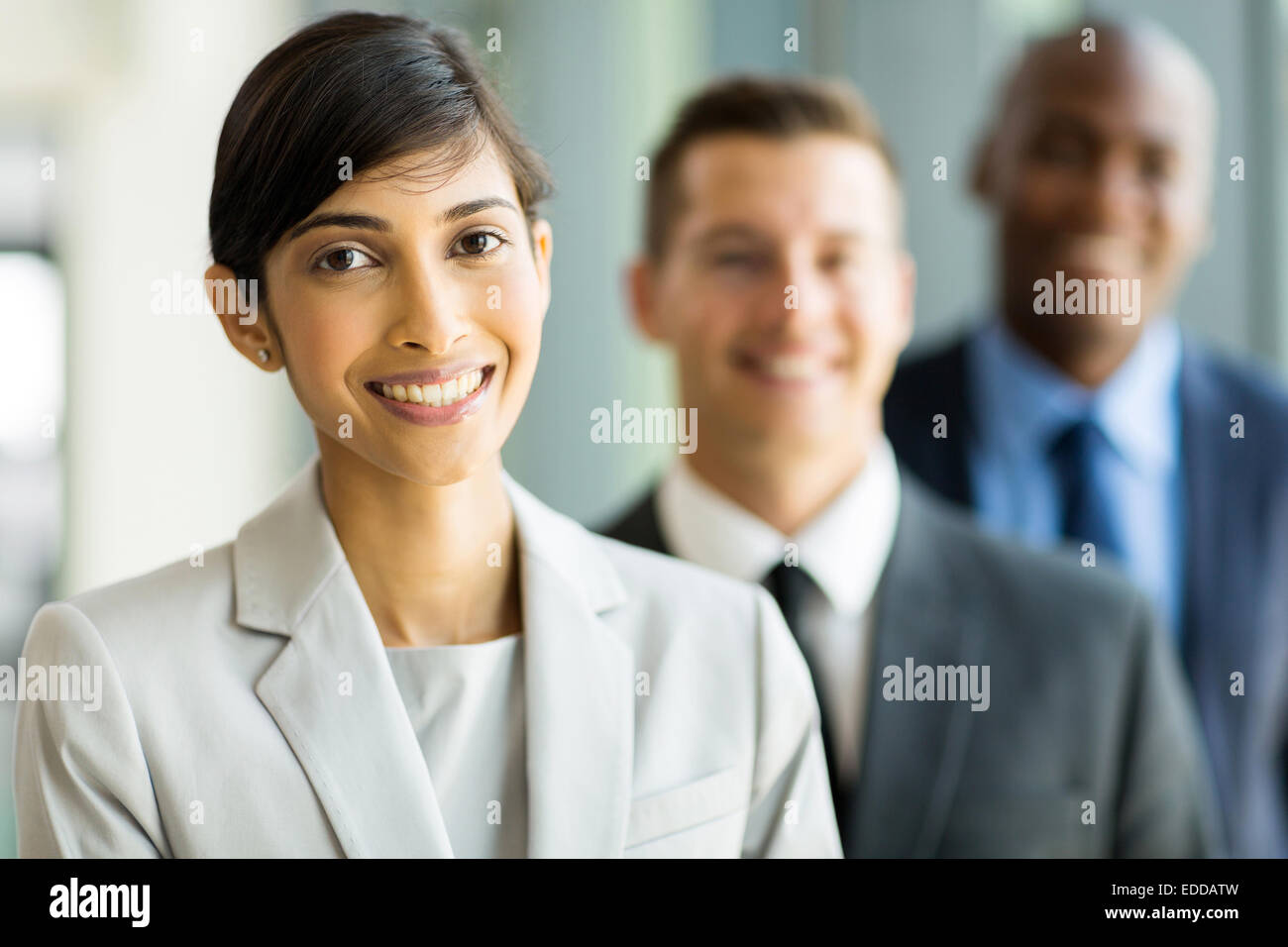 attractive Indian female business leader with colleagues standing on ...