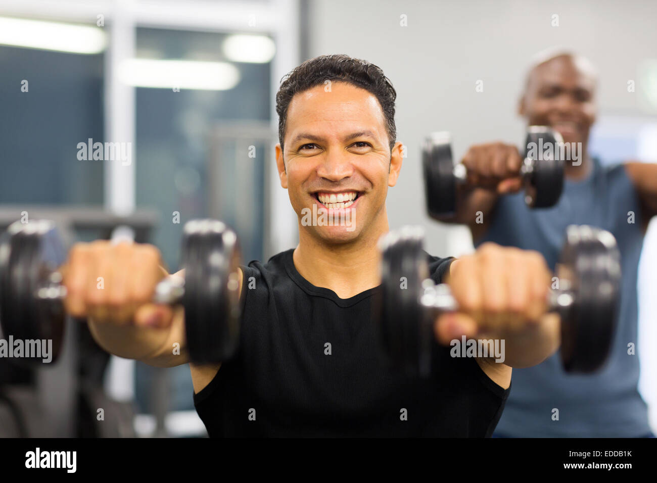 portrait of healthy man working out with dumbbells Stock Photo - Alamy