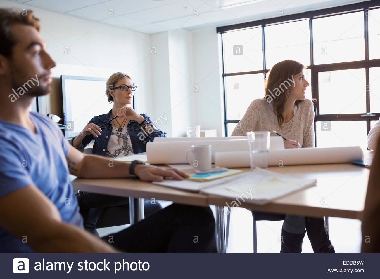 Business people working on blueprints hi-res stock photography and ...