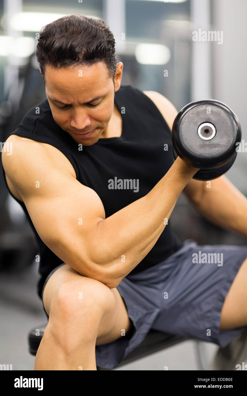 Man with heavy dumbbell hi-res stock photography and images - Alamy