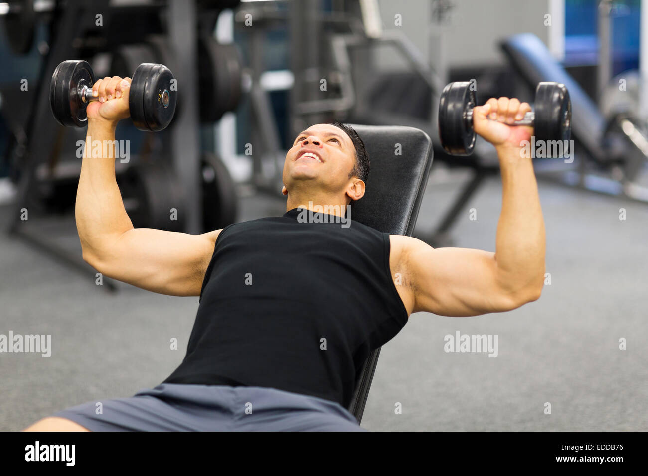 strong middle aged man lifting weights in gym Stock Photo - Alamy