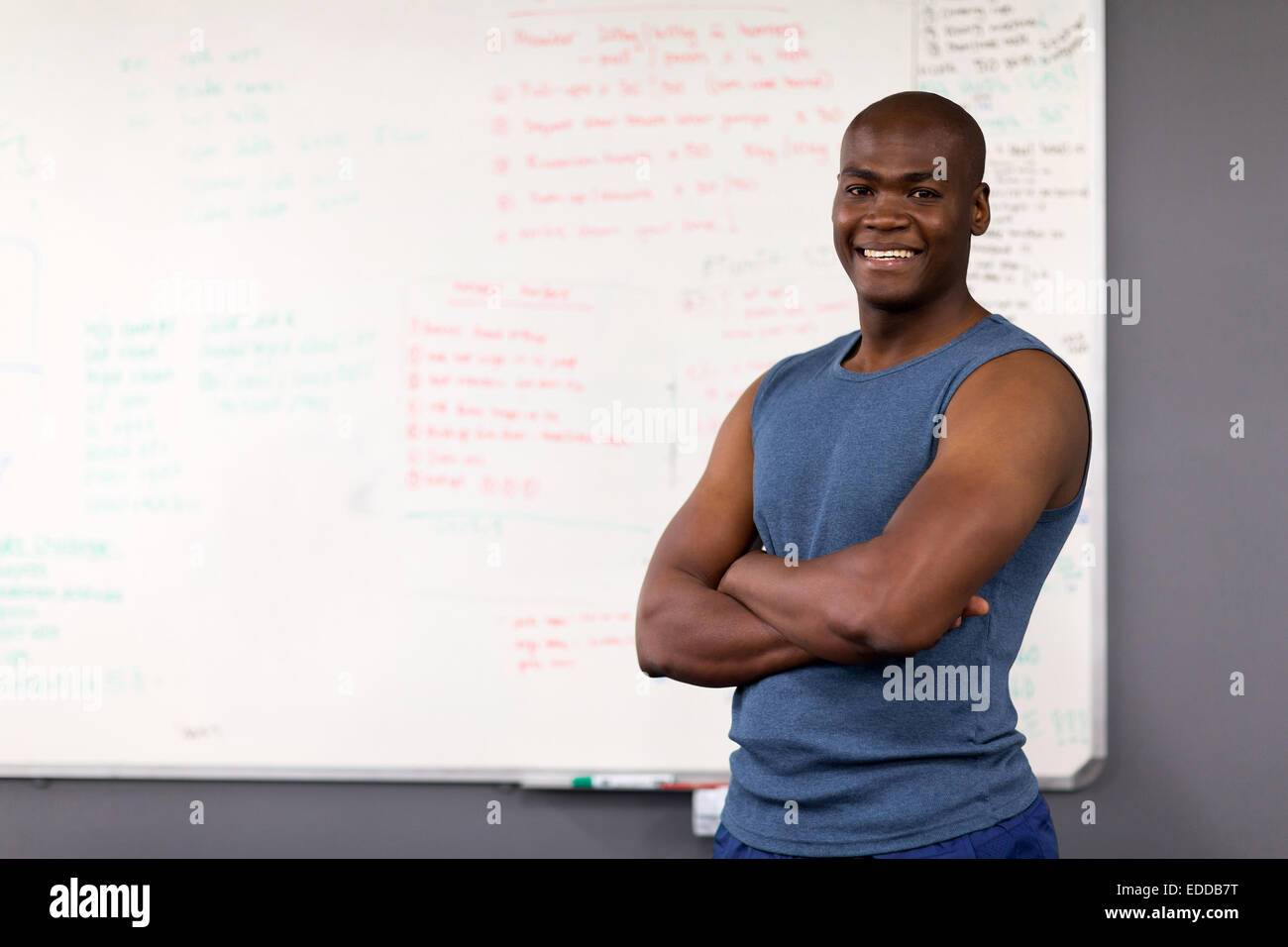 happy African American gym coach in classroom Stock Photo - Alamy