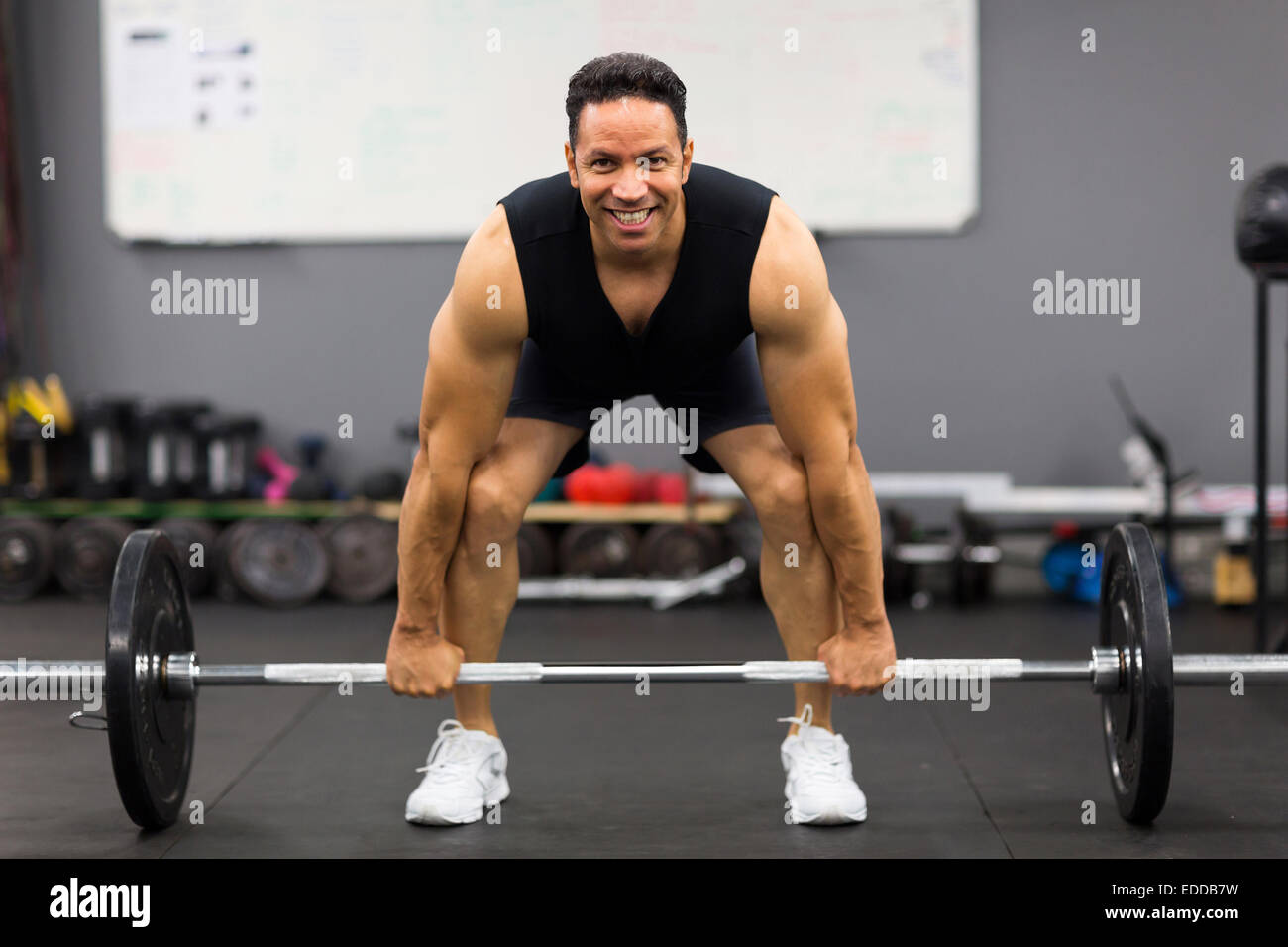 fitness middle aged man lifting barbell in gym Stock Photo - Alamy