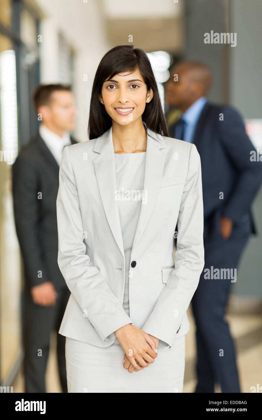 attractive female office worker with colleagues on background Stock ...